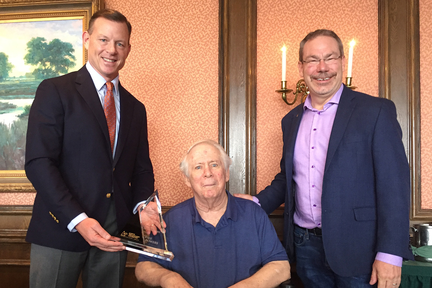 Admiral Bobby Inman and Pike Powers receive the George Kozmetsky ...